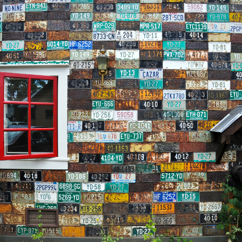 Art House Covered In License Plates With Red Window In Photograph Print art-house-covered-in-license-plates-with-red-window-in-photograph-print